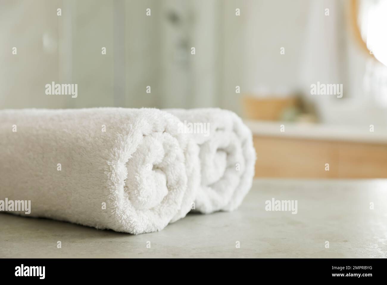 Rolled towels on table hi-res stock photography and images - Alamy