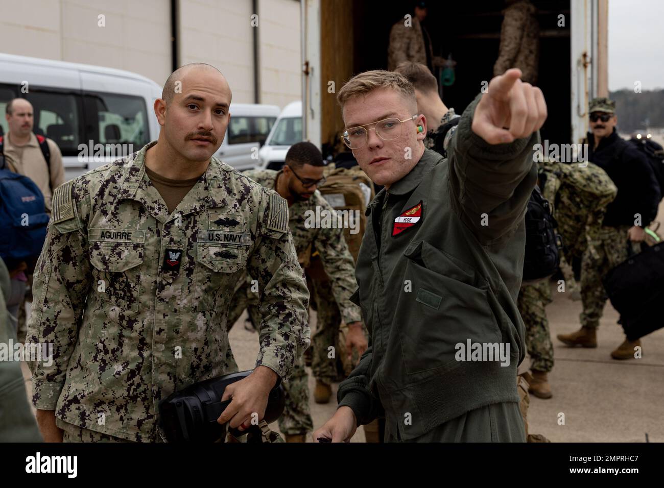 U.S. Marine Corps Cpl. Eric Hogarth (right), a loadmaster with Marine ...