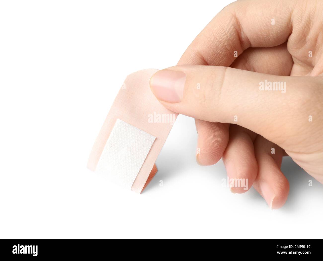 Woman putting sticking plaster on white background. First aid item ...