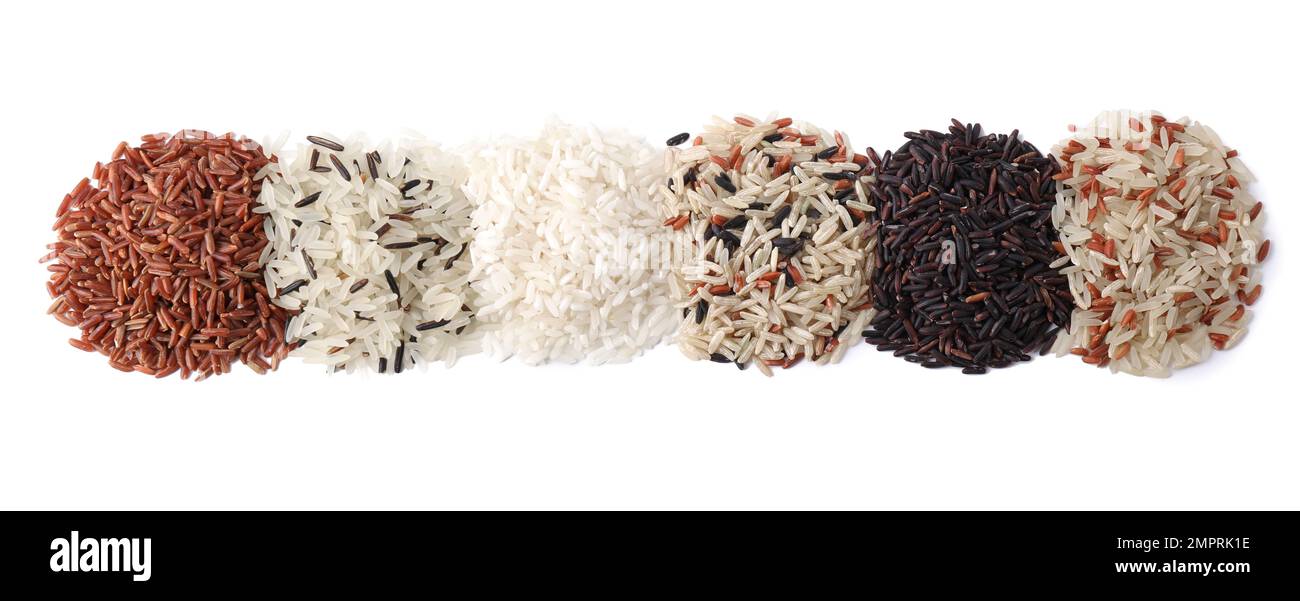Different types of brown and polished rice isolated on white, top view ...