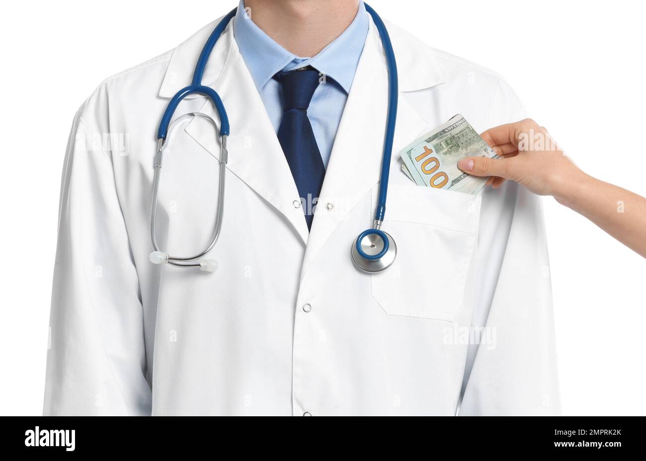 Patient putting bribe into doctor's pocket on white background, closeup ...
