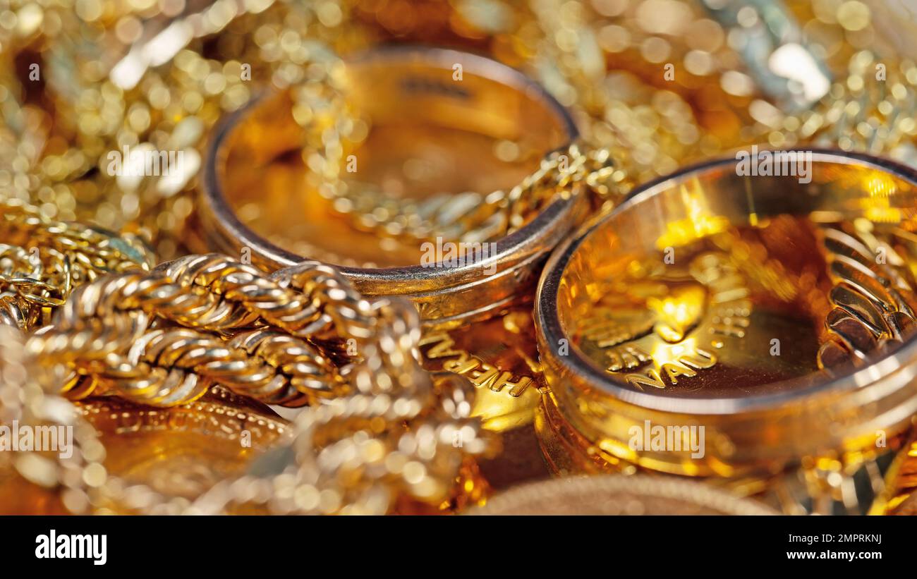 Gold jewelry, gold coins and gold bars in a close-up Stock Photo - Alamy