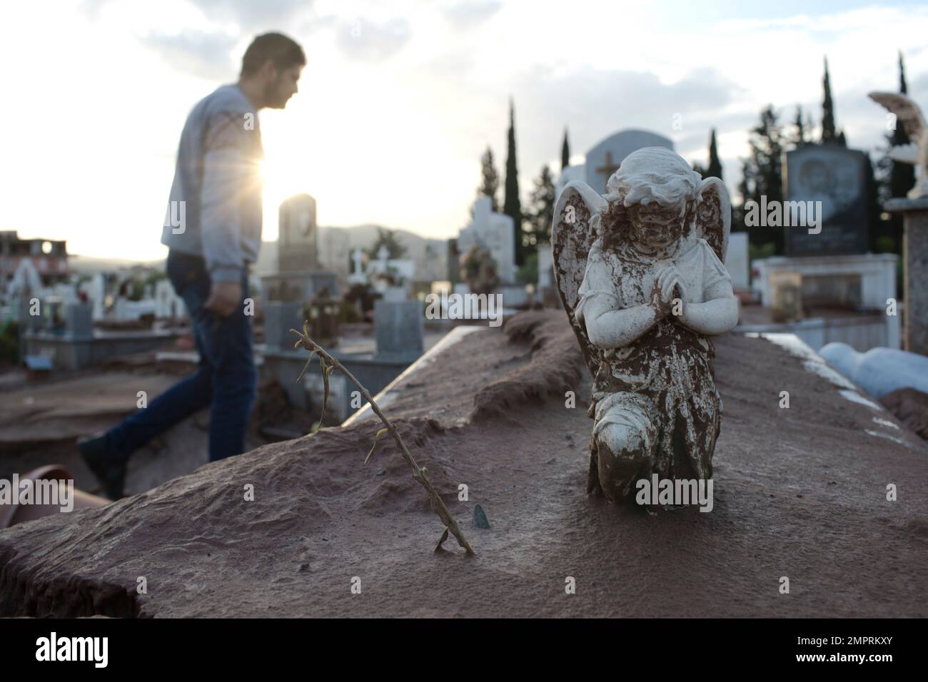 In this Friday , Nov. 17, 2017 photo, a man walks past a tomb covered ...