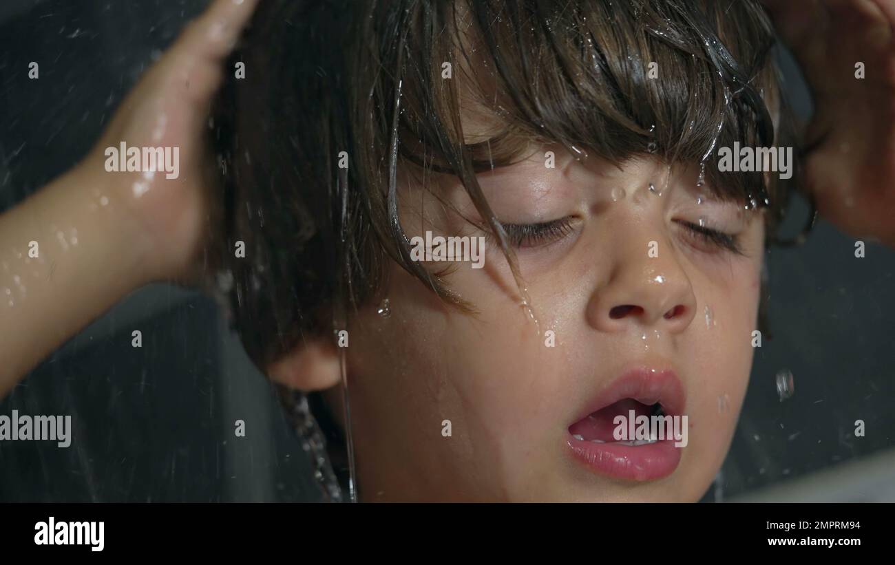 Small boy at shower bath in slow motion. Showering child hygiene ...