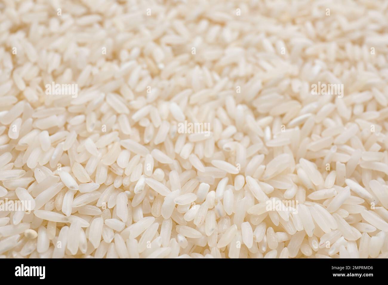 Pile of polished rice as background, closeup Stock Photo - Alamy