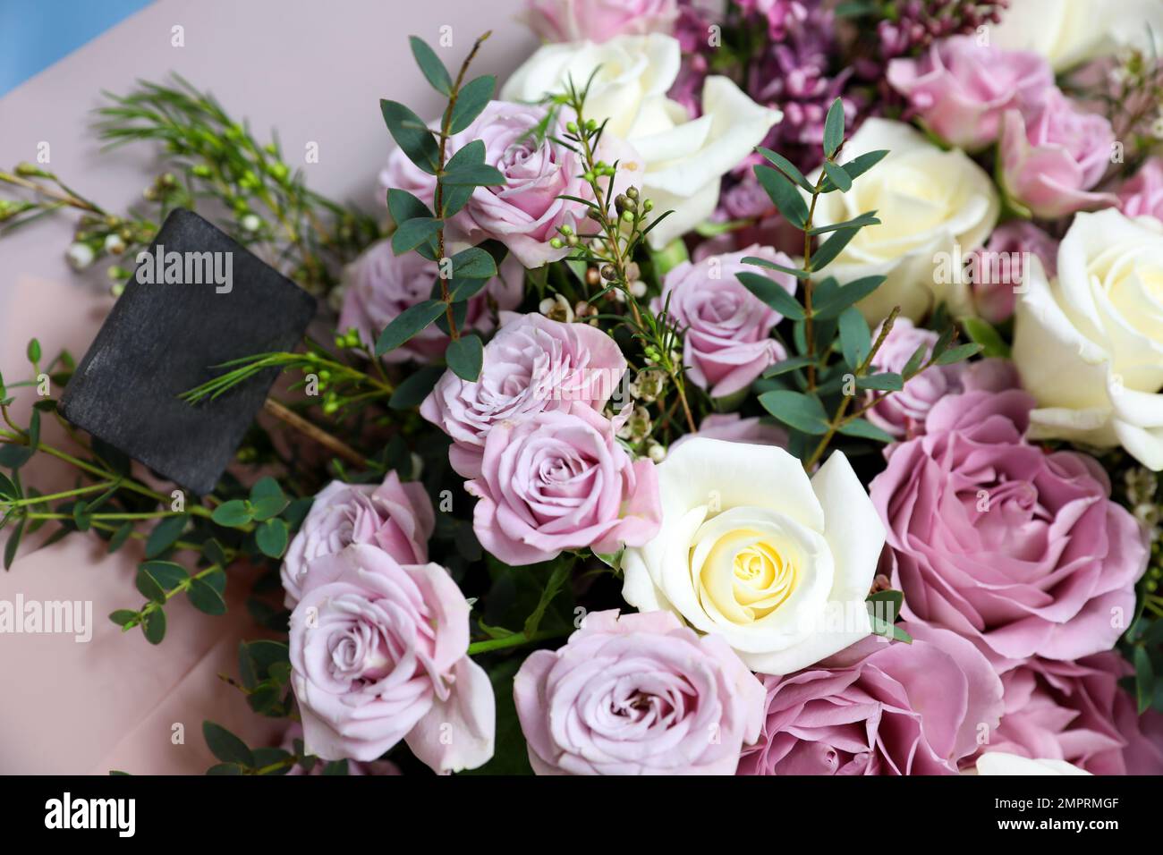 Beautiful fresh roses with price tag, closeup. Floral shop Stock Photo ...