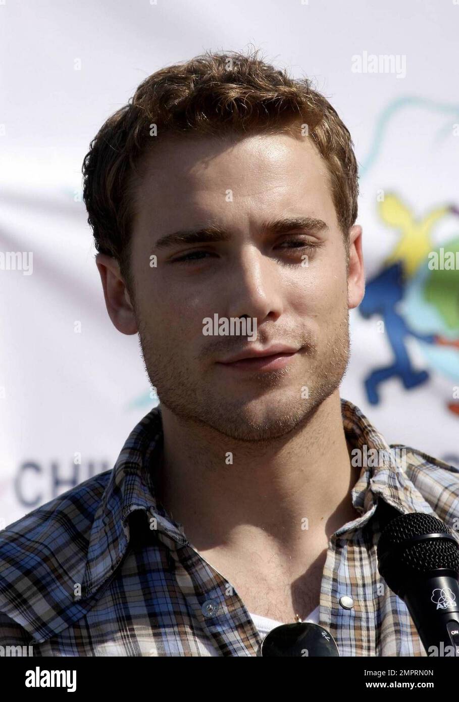 Dustin Milligan attends the Children Uniting Nations Day at Dodger ...