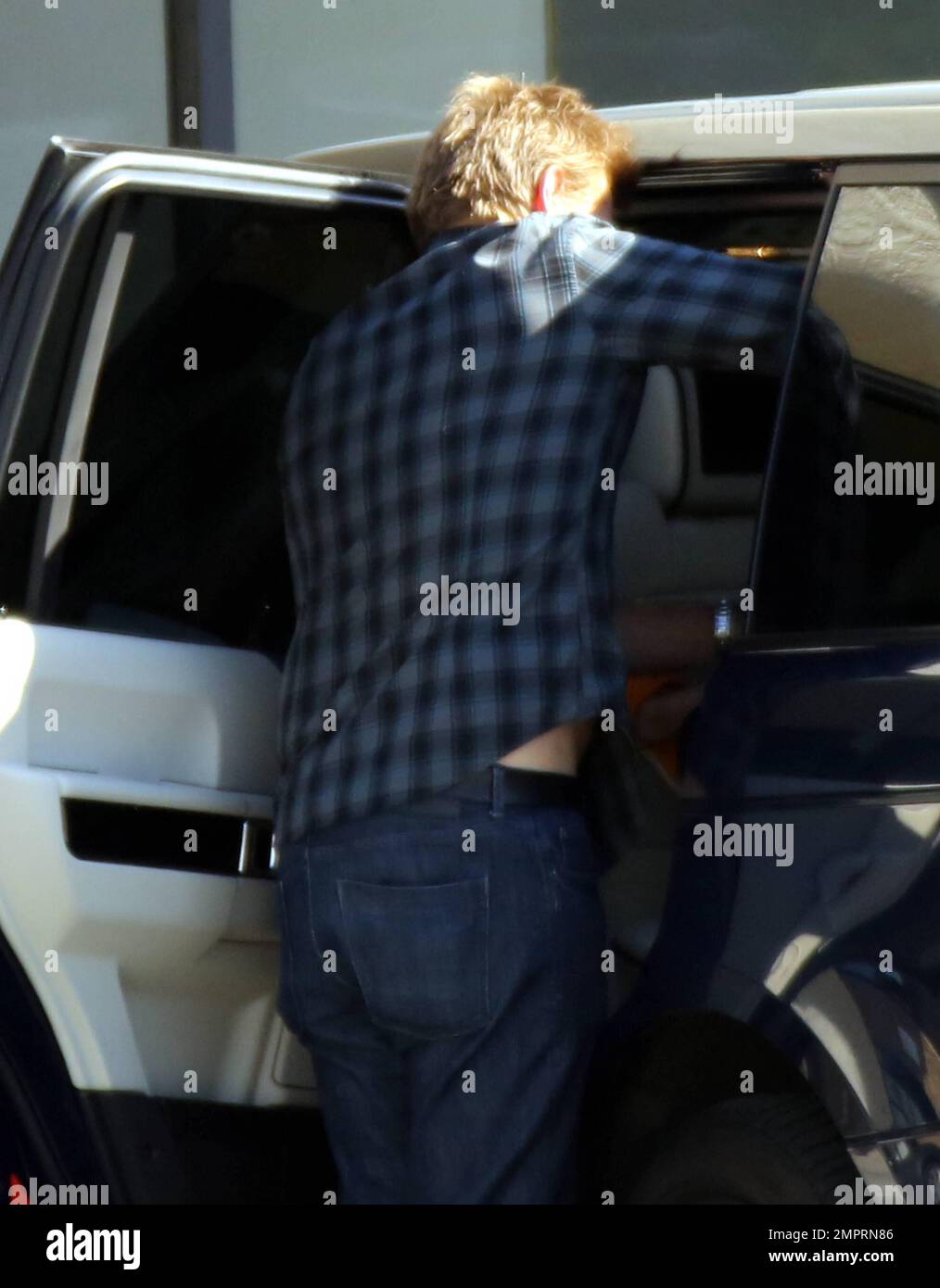 Australian celebrity chef, Curtis Stone, carries his son Hudson to the ...