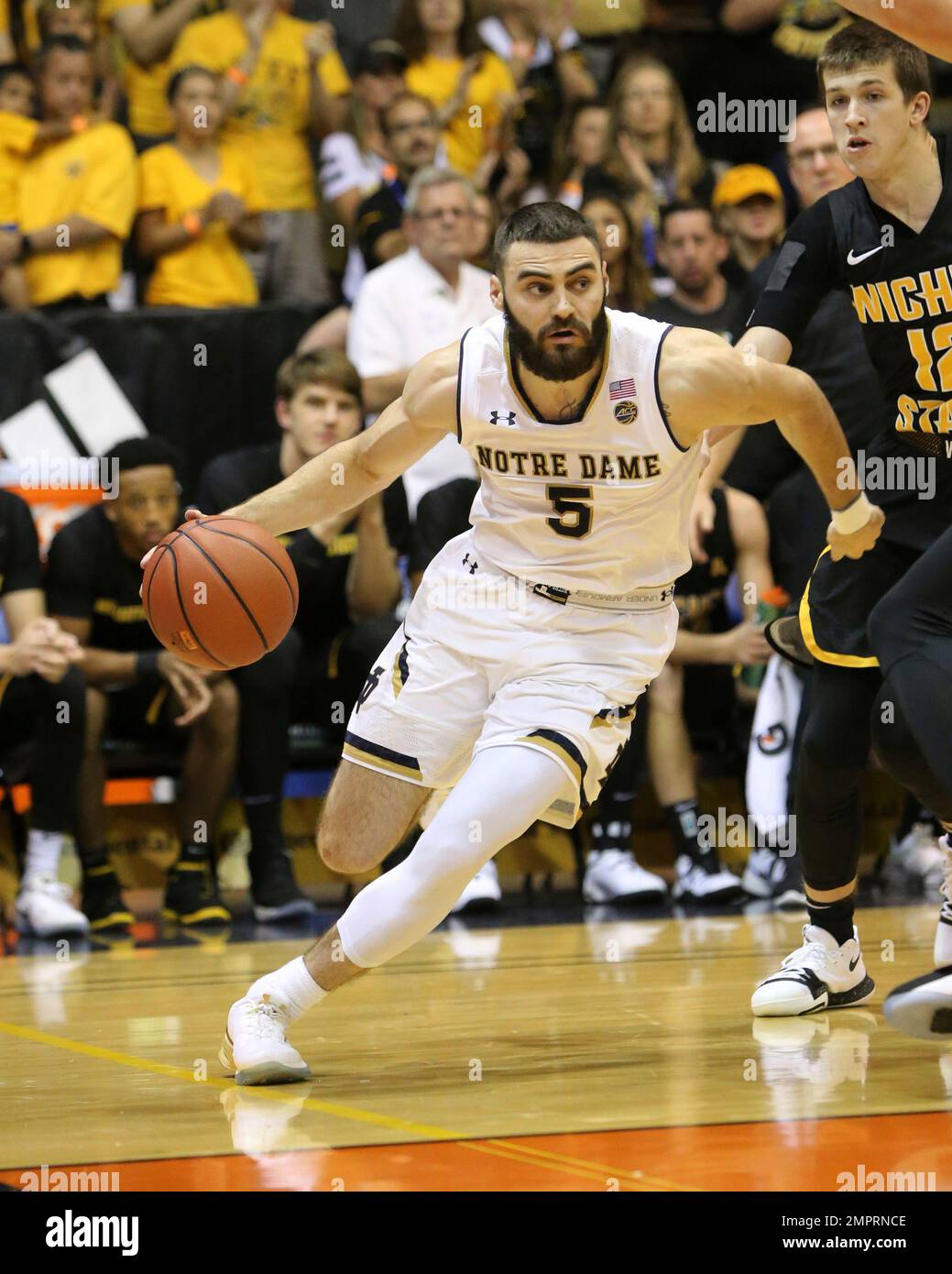 Notre Dame guard Matt Farrell (5) cuts through the Wichita State ...