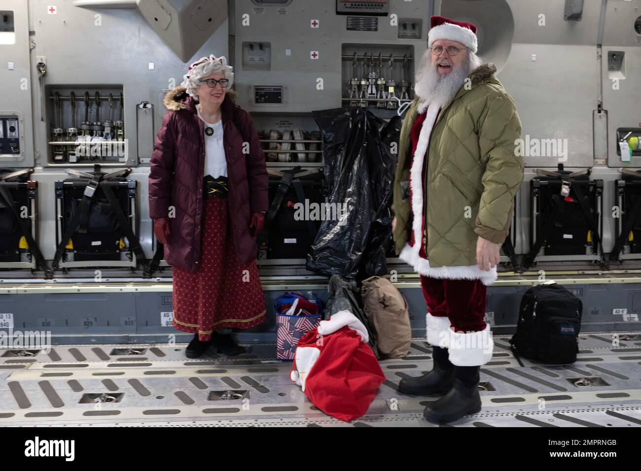 Santa and Mrs. Claus prepare to exit their upgraded sleigh, a 176th ...