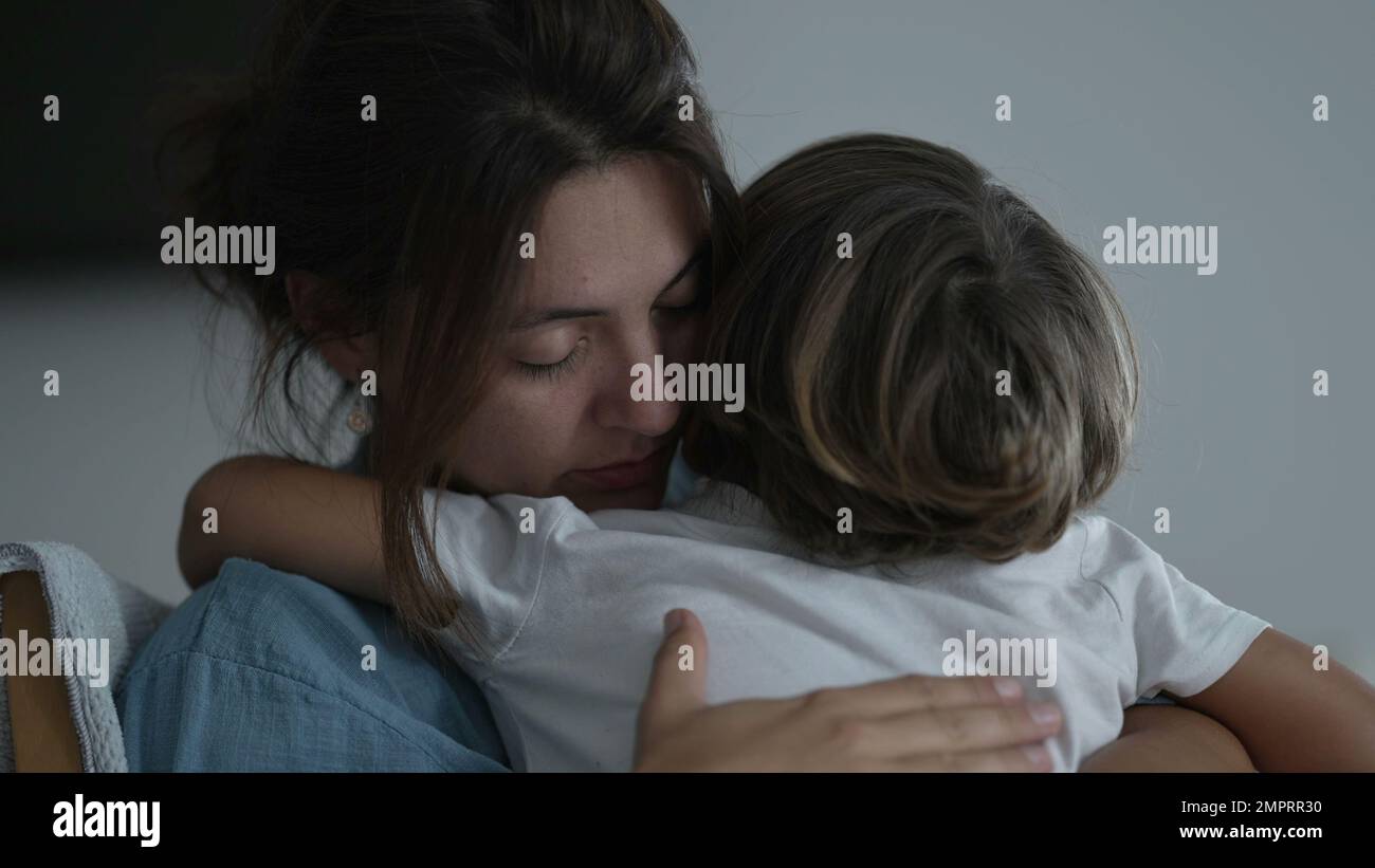 Mother caressing crying child back. Mom consoling son. Lifestyle ...