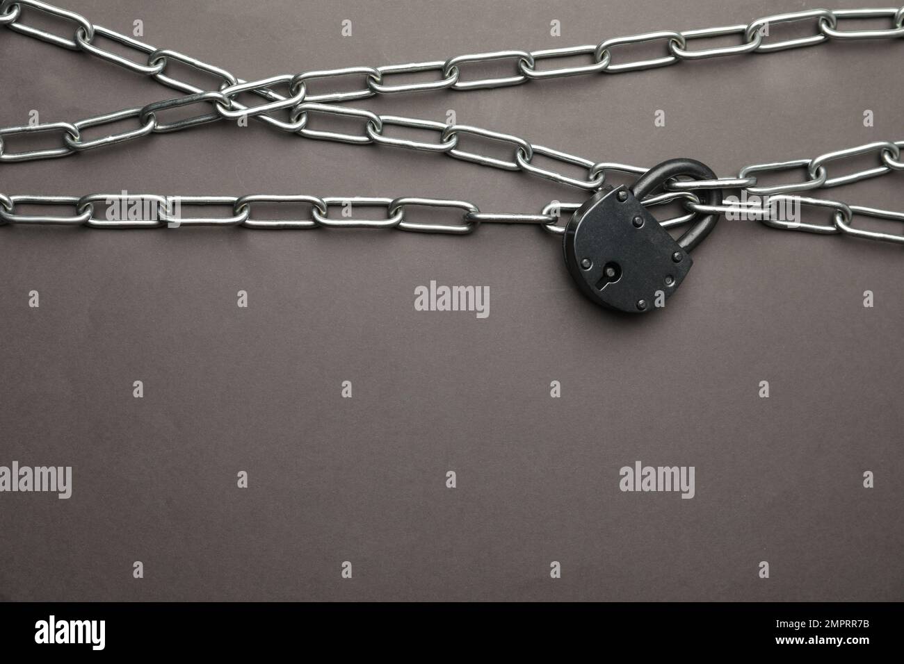 Steel padlock, chains and space for text on grey background, flat lay ...