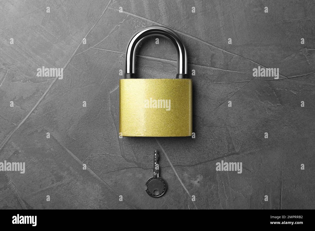 Steel padlock and key on grey background, top view. Safety concept ...