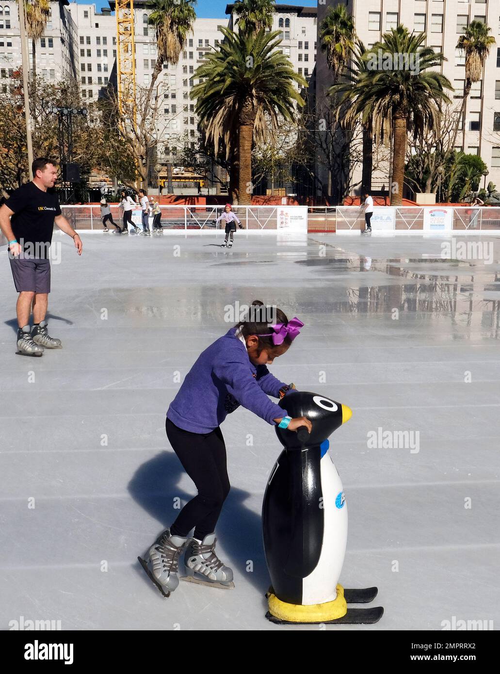 Ice skaters make their way around the Holiday Ice Rink in Pershing ...
