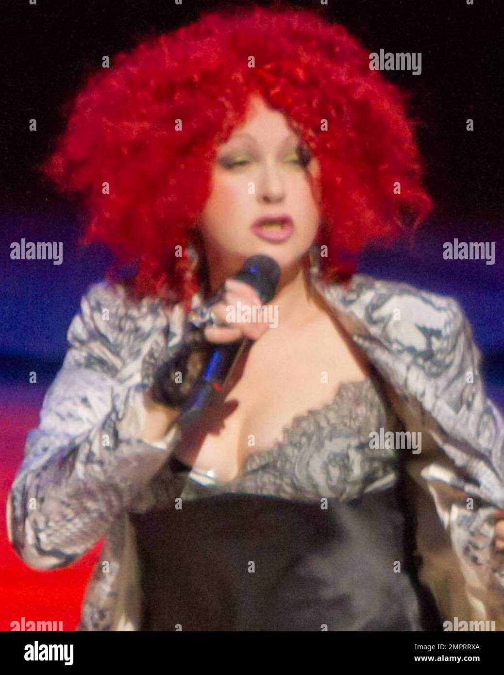 Legendary pop singer Cyndi Lauper shows off a trademark wild hairdo as ...