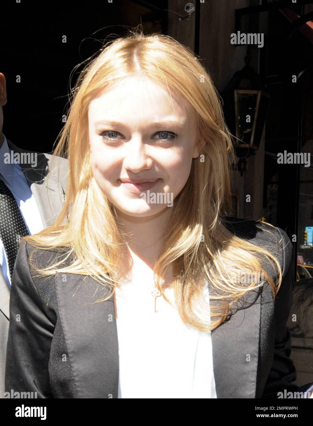Dakota Fanning signs autographs and poses for photos with fans while ...