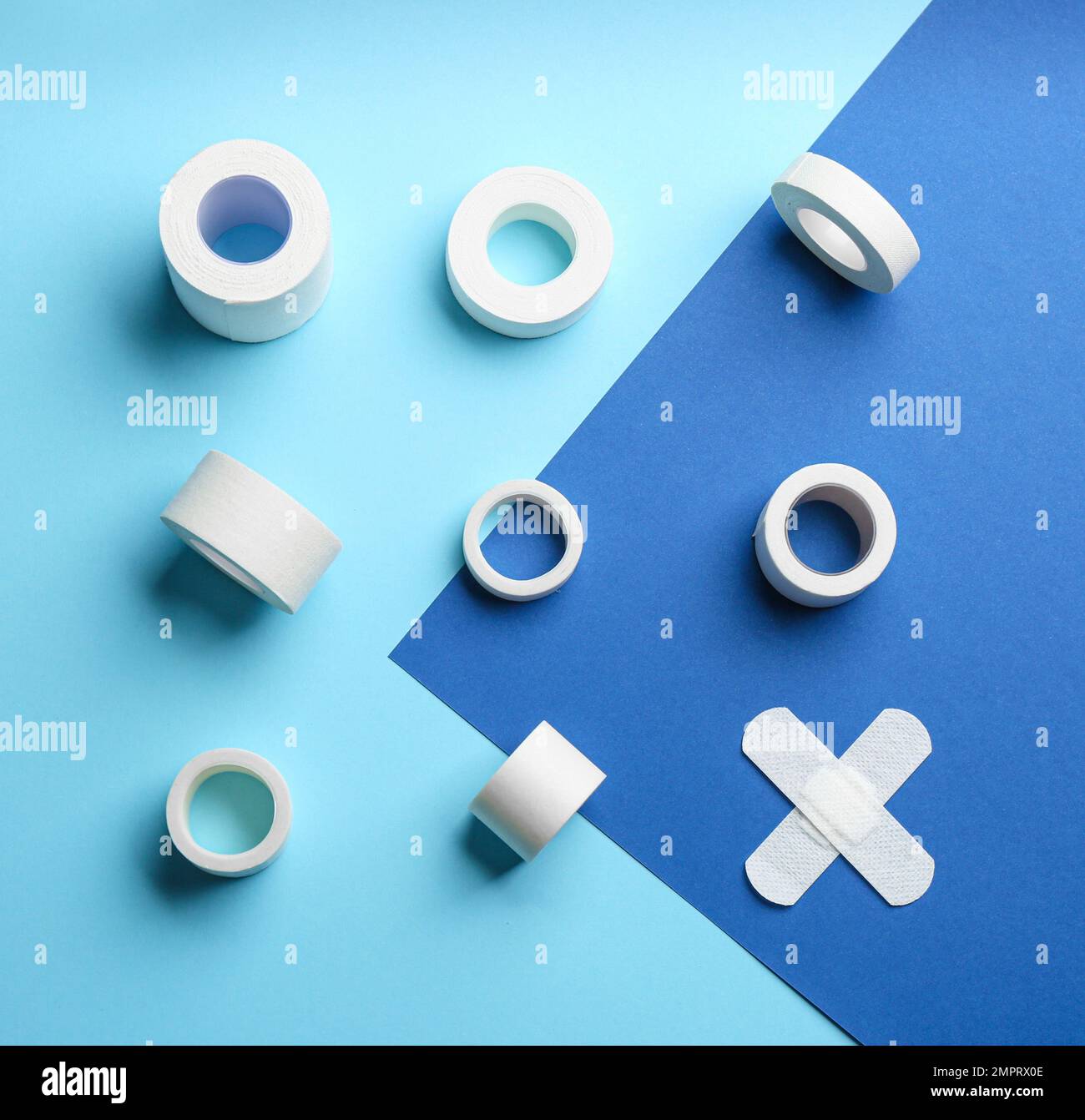 Different types of sticking plasters on blue background, flat lay Stock ...