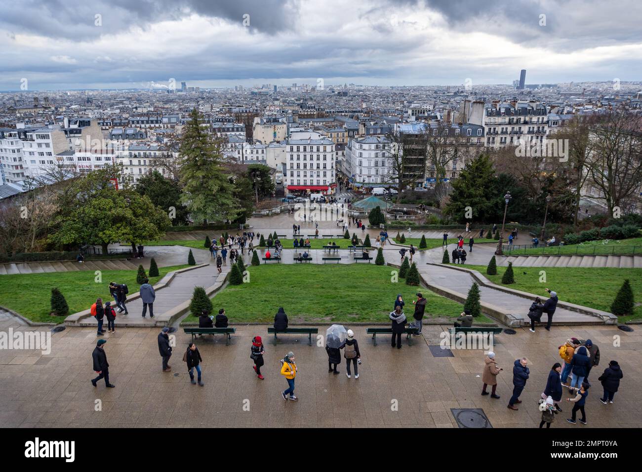 Tourists enjoy the view of Paris, France as seen from the steps of the ...