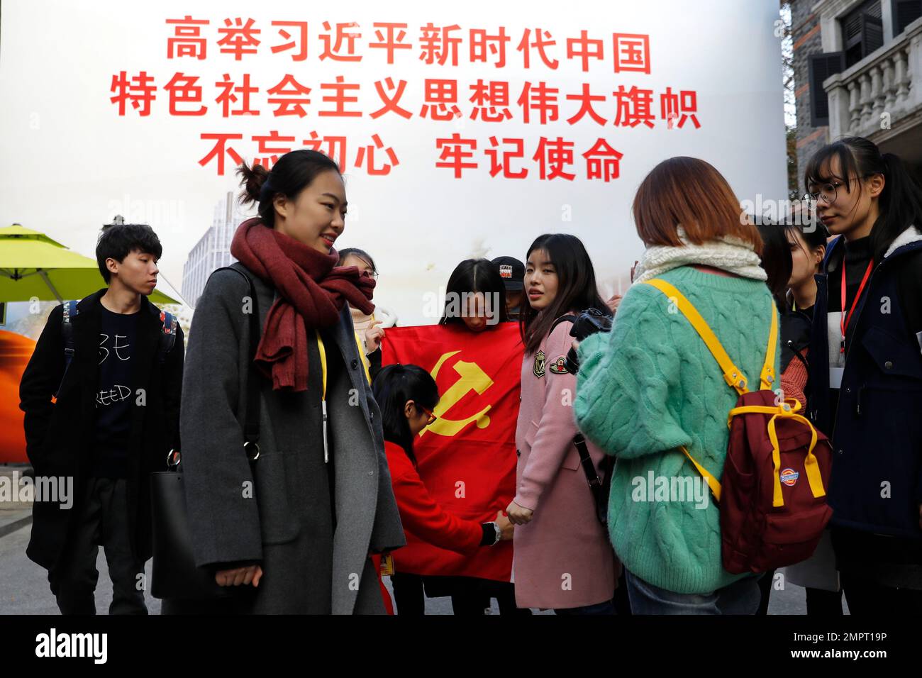 In this Nov. 19, 2017, photo, a group of university students fold a ...