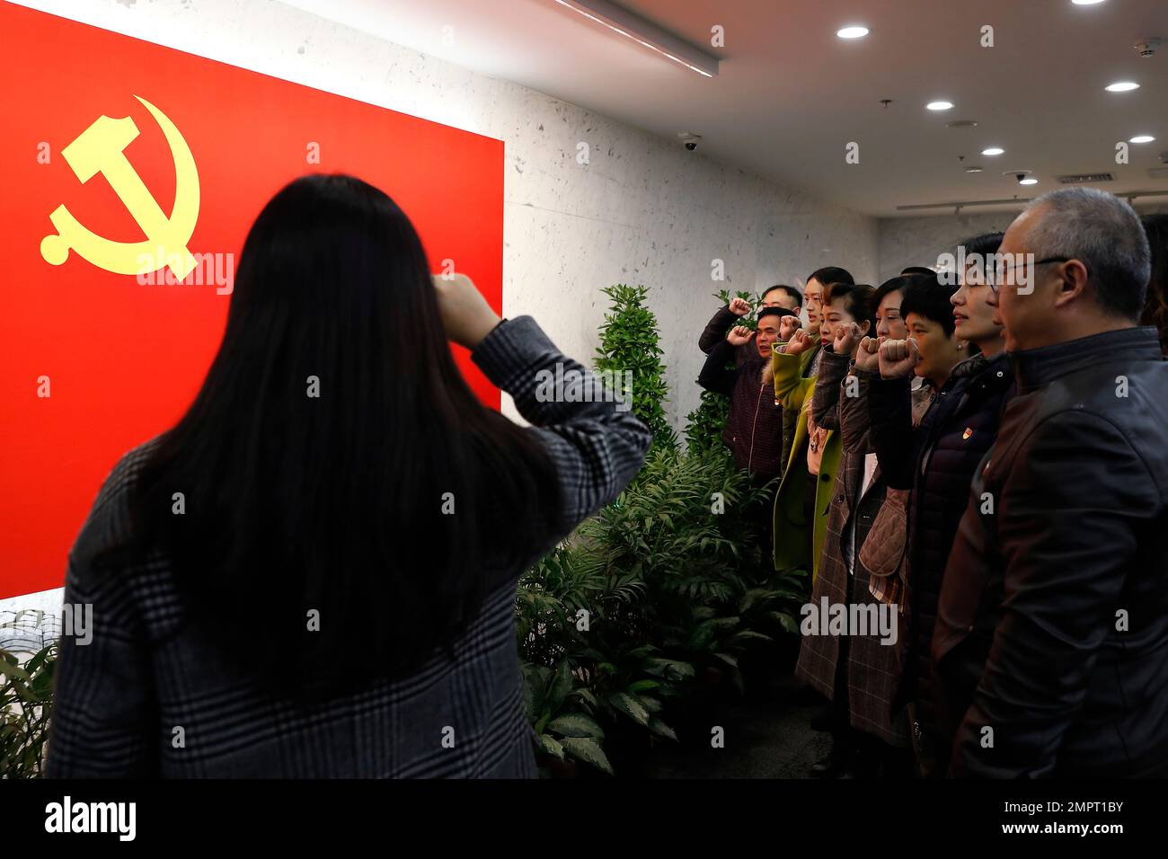 In this Nov. 19, 2017, photo, a group of Chinese visitors raise their ...