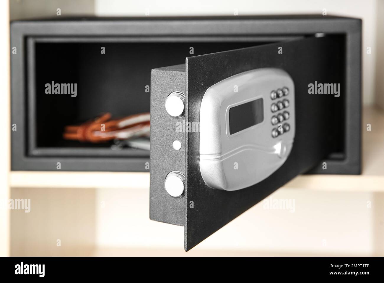 Open steel safe with wallet, focus on door Stock Photo - Alamy