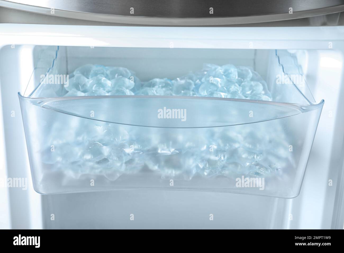 Plastic bags with ice cubes in fridge Stock Photo - Alamy