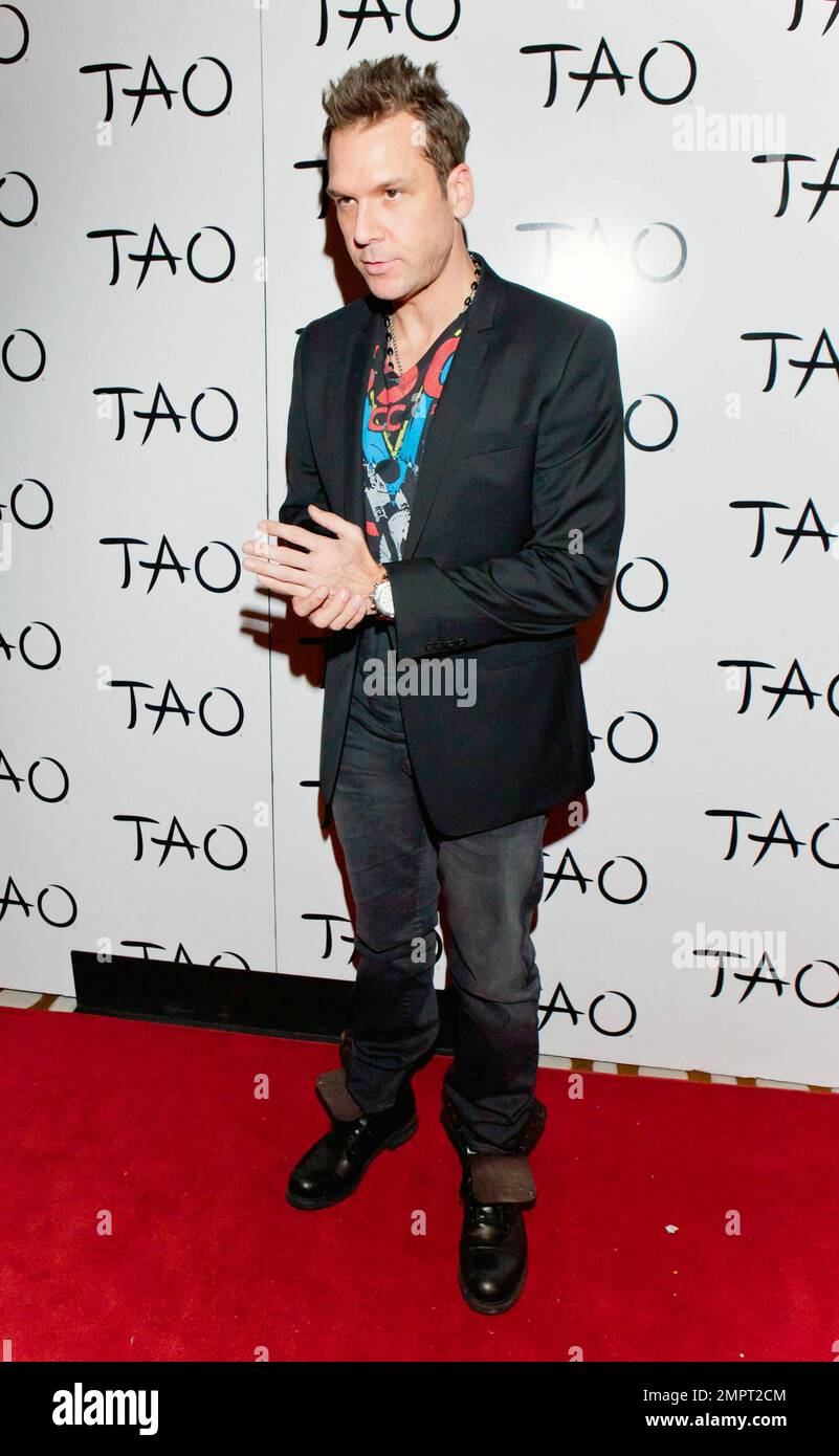 With his hair styled and wearing trendy undone boots with his pants ...