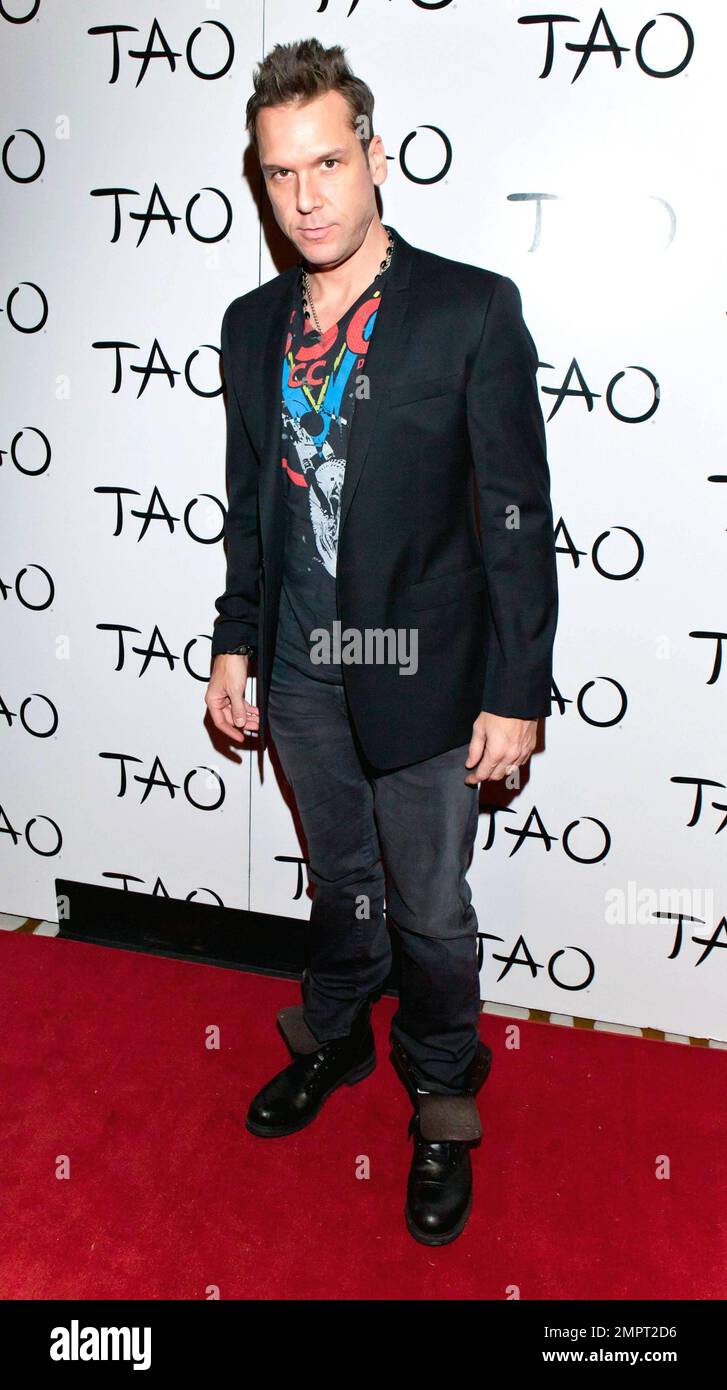 With his hair styled and wearing trendy undone boots with his pants ...