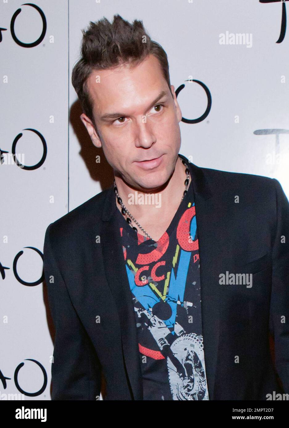 With his hair styled and wearing trendy undone boots with his pants ...