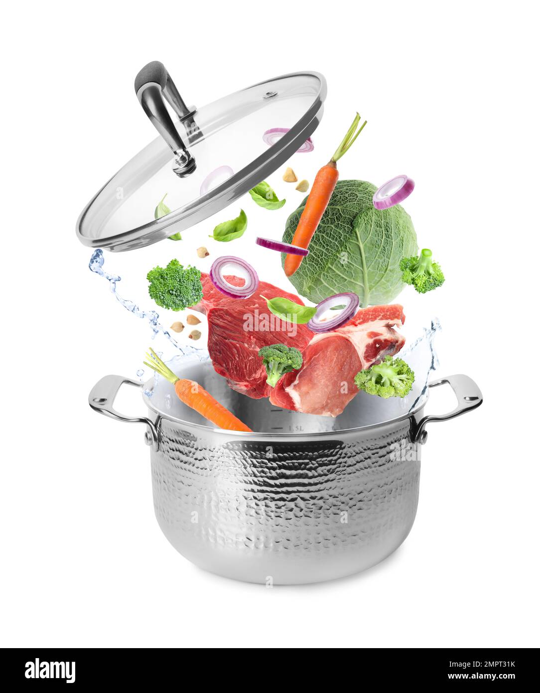 Many different ingredients falling into pot on white background Stock ...