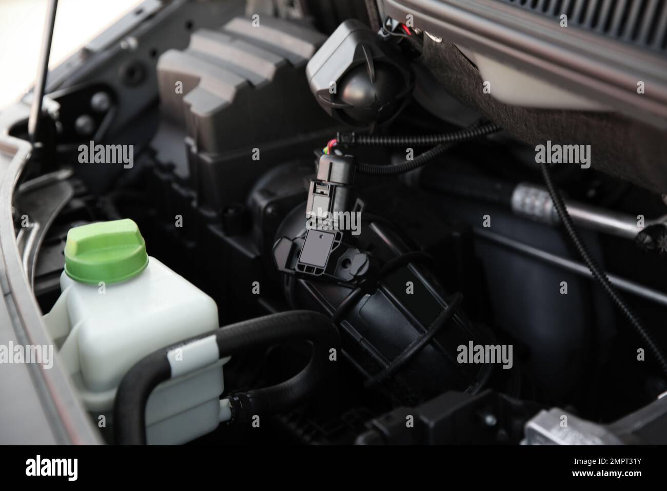 Closeup view of engine bay in modern car Stock Photo - Alamy