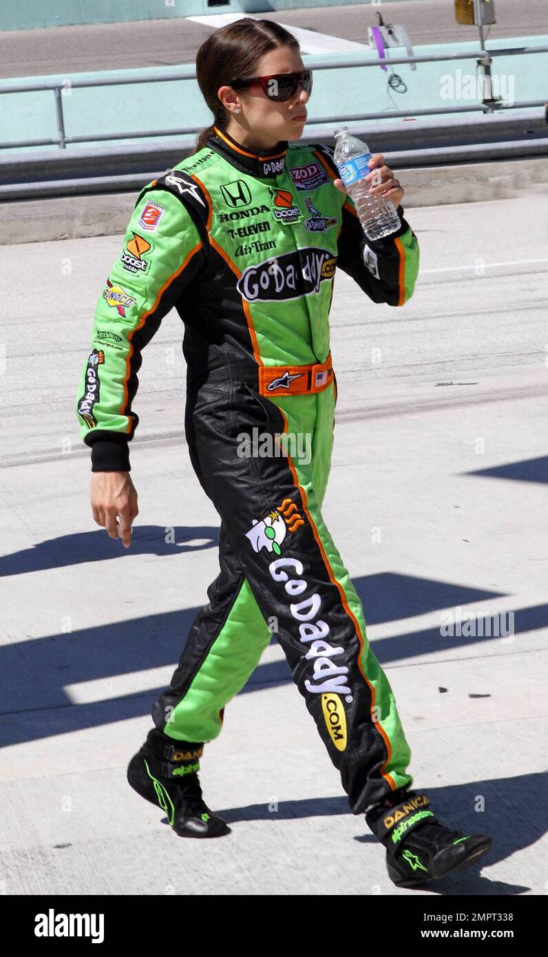 IndyCar driver Danica Patrick, 28, nonchalantly signs autographs as she ...