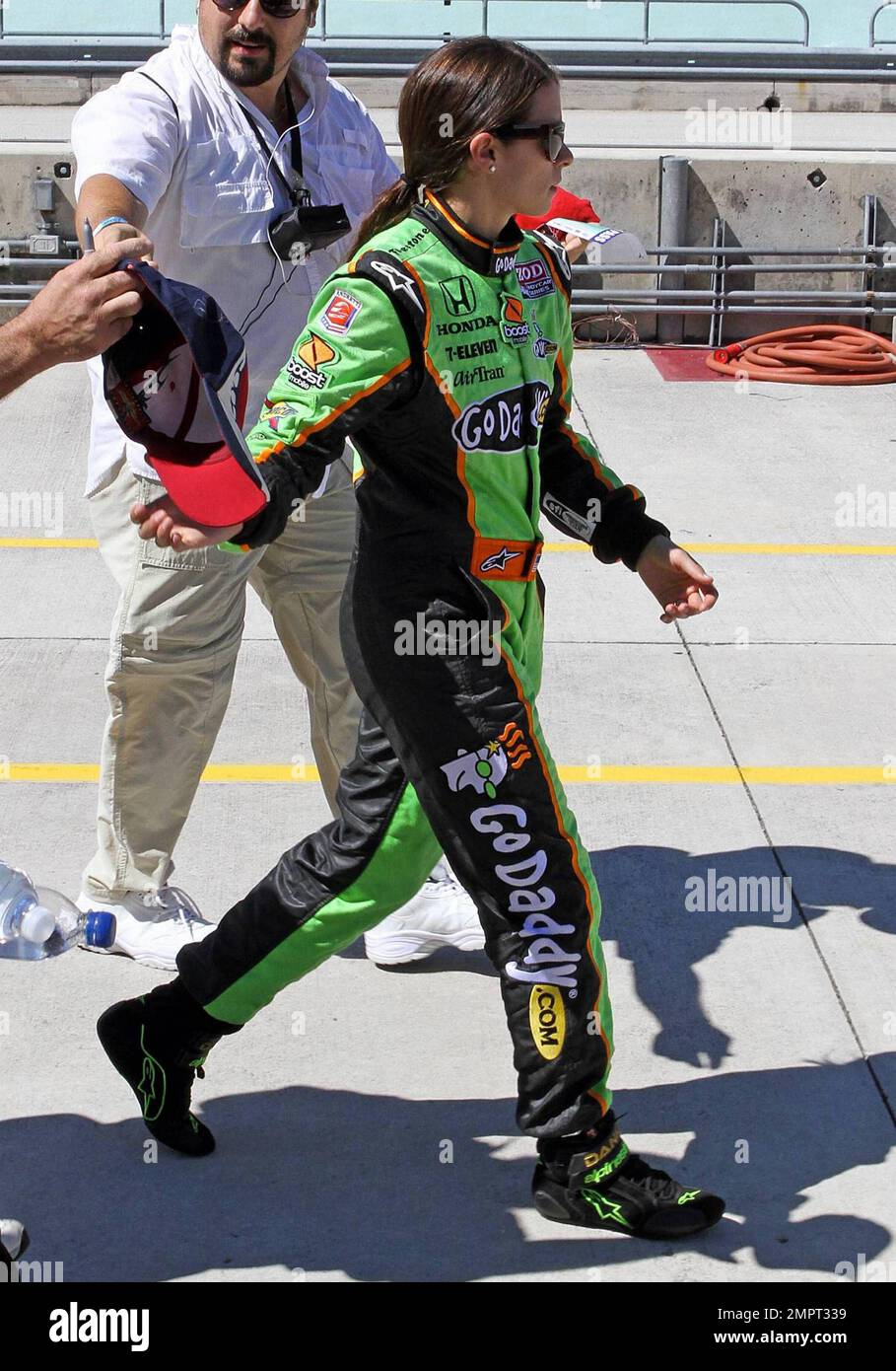 IndyCar driver Danica Patrick, 28, nonchalantly signs autographs as she ...