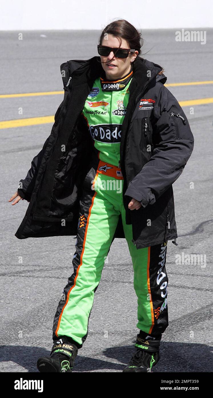 Danica Patrick walks out to her car on pit row for her NASCAR debut in ...