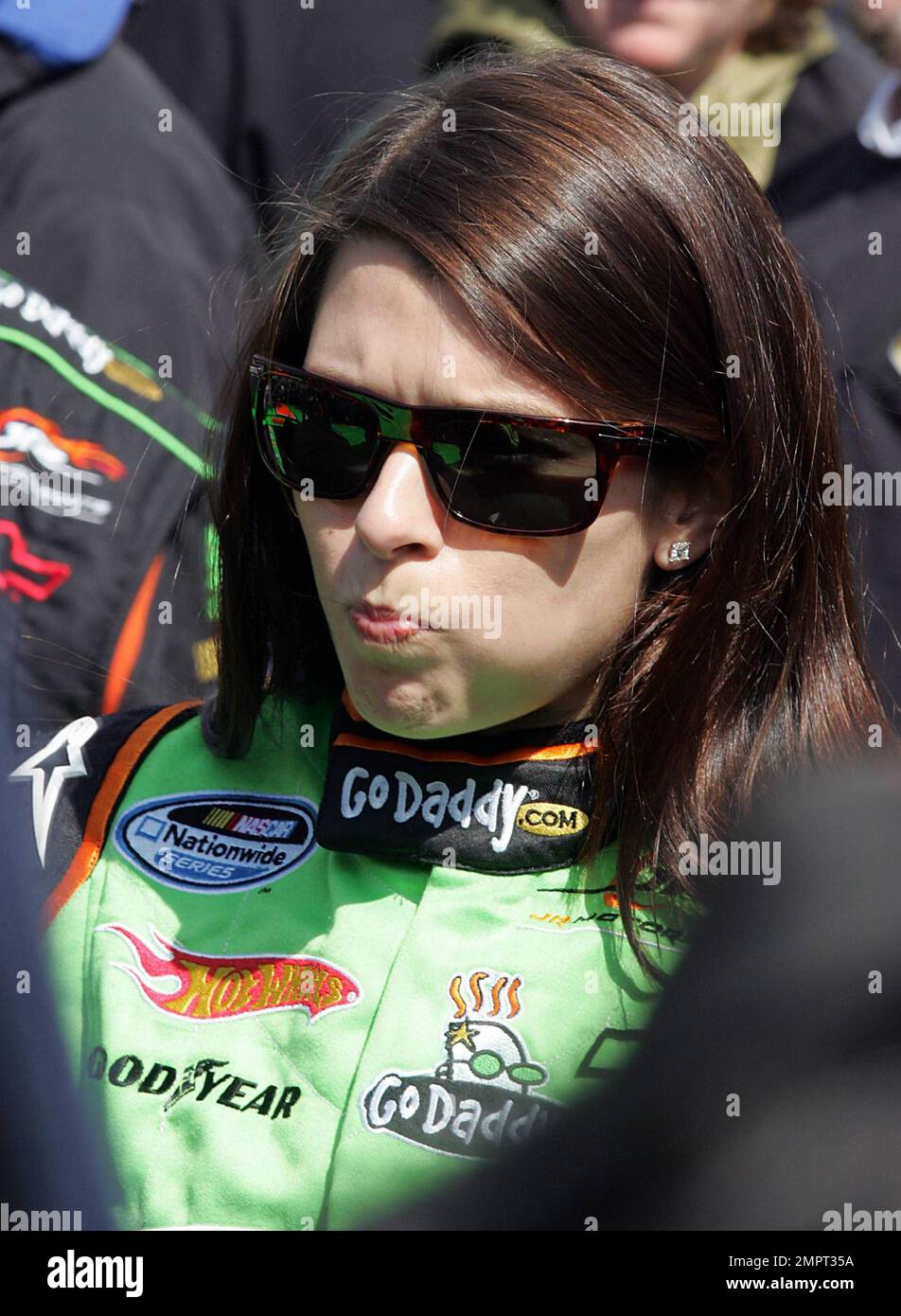 Danica Patrick walks out to her car on pit row for her NASCAR debut in ...
