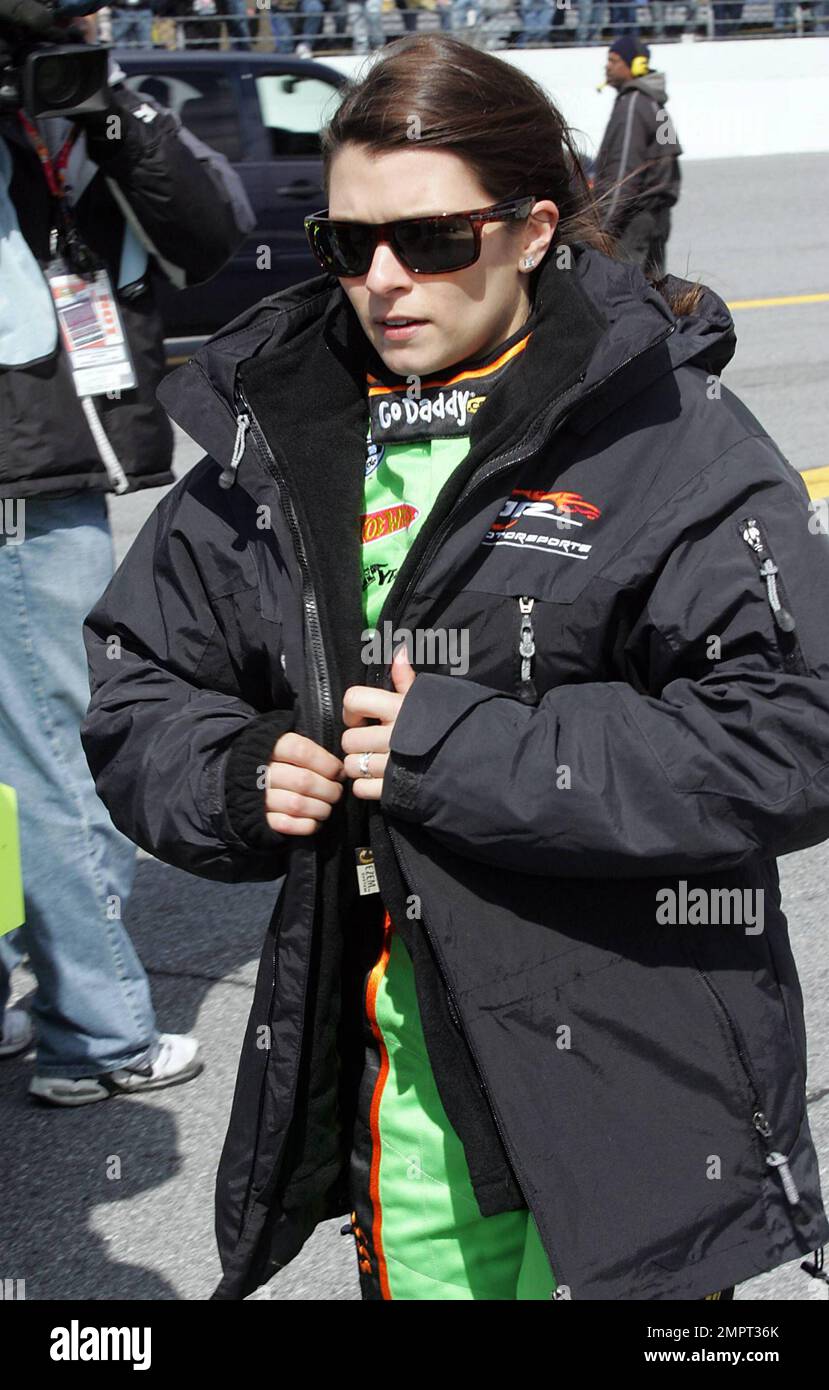 Danica Patrick walks out to her car on pit row for her NASCAR debut in ...