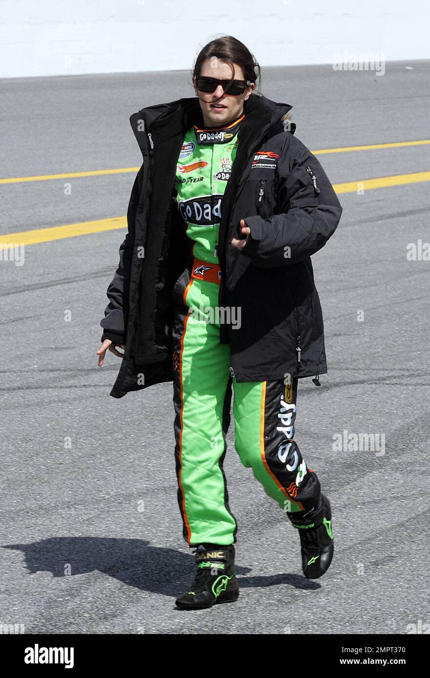 Danica Patrick walks out to her car on pit row for her NASCAR debut in ...