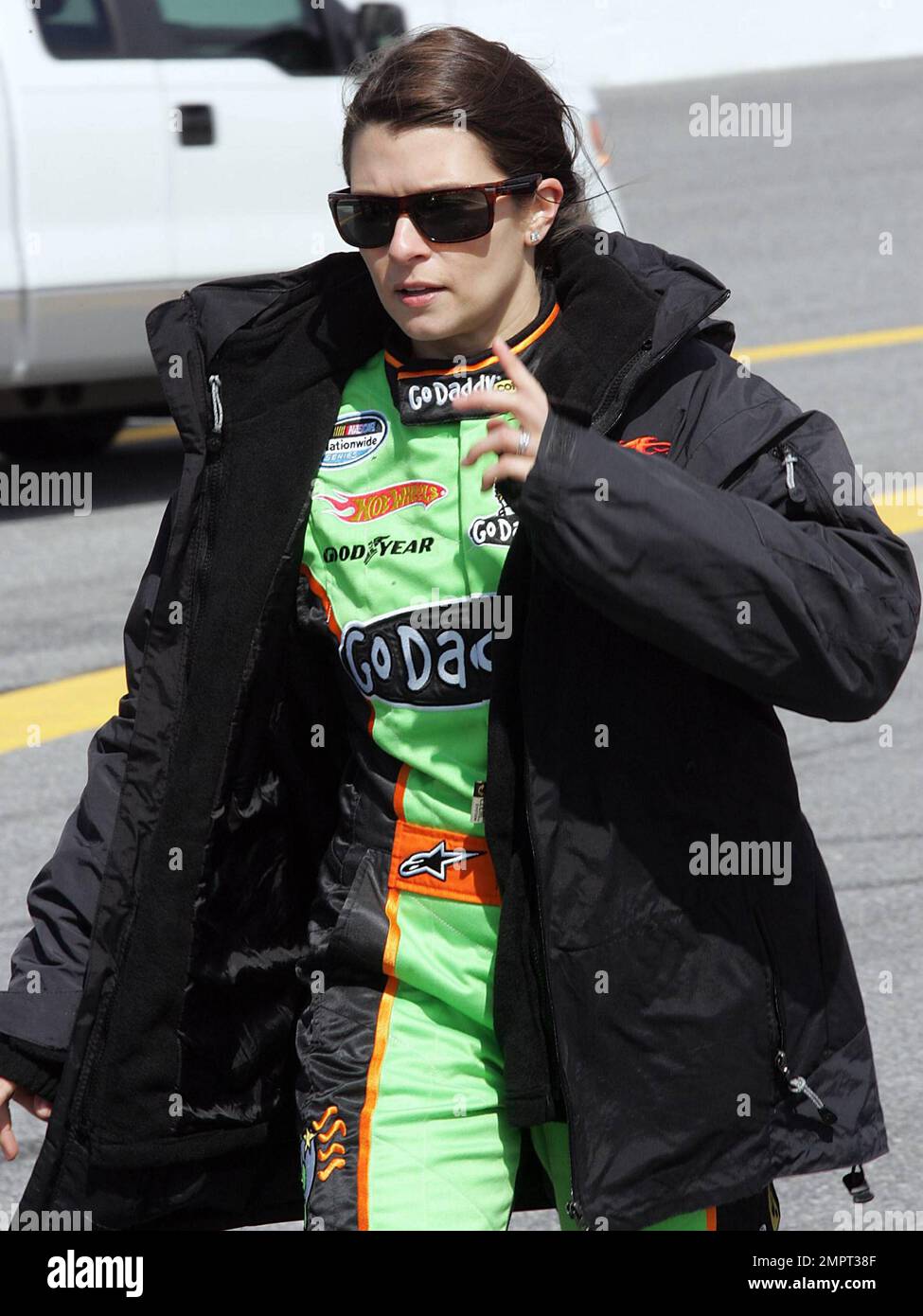 Danica Patrick walks out to her car on pit row for her NASCAR debut in ...