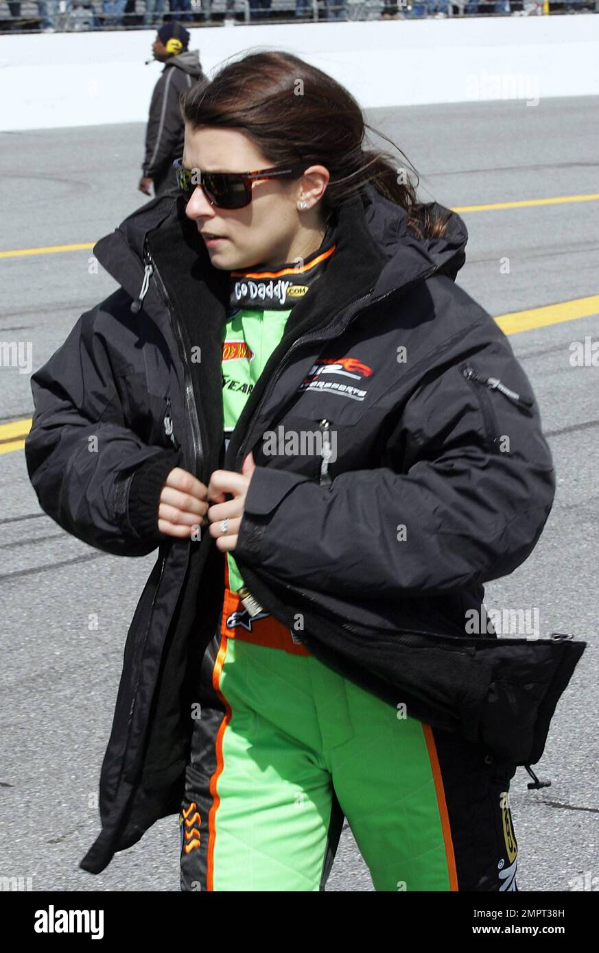 Danica Patrick walks out to her car on pit row for her NASCAR debut in ...