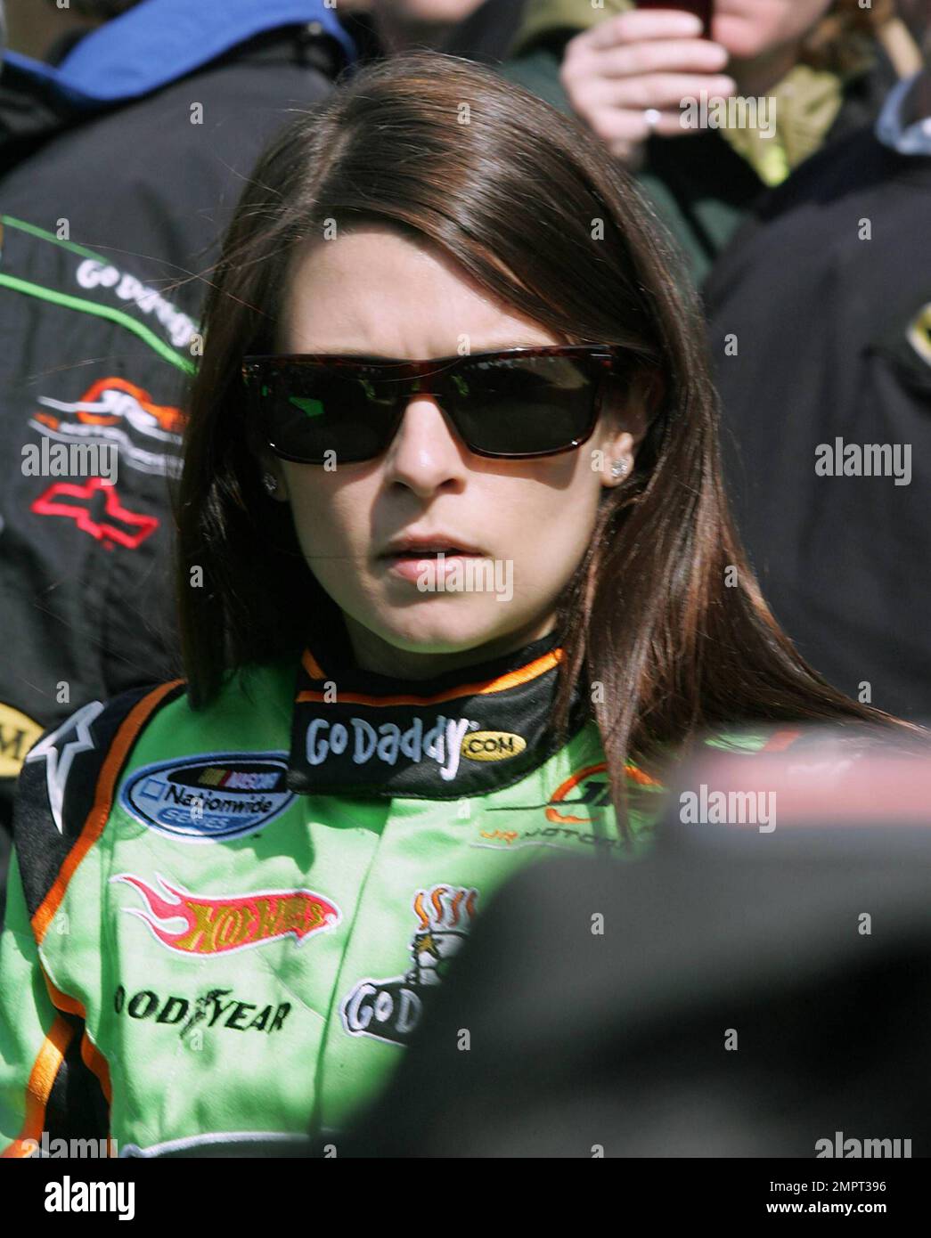 Danica Patrick walks out to her car on pit row for her NASCAR debut in ...