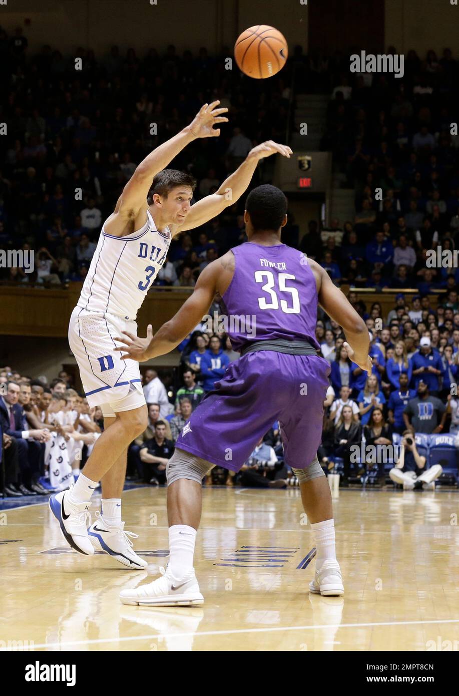 Duke's Grayson Allen (3) passes over Furman's Daniel Fowler (35) during ...