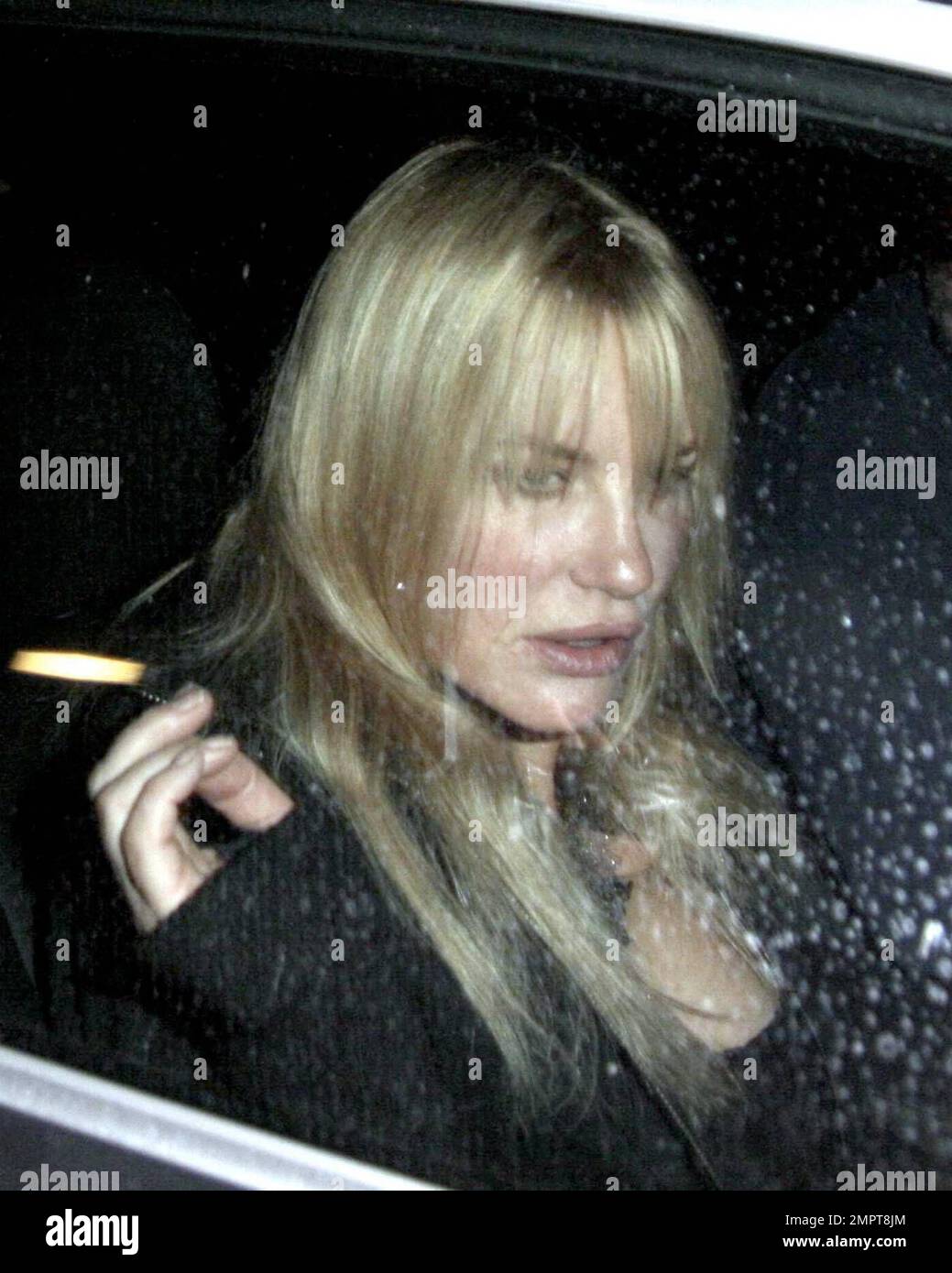 Actress Darryl Hannah leaves Crown Bar out the back door. Once she was ...