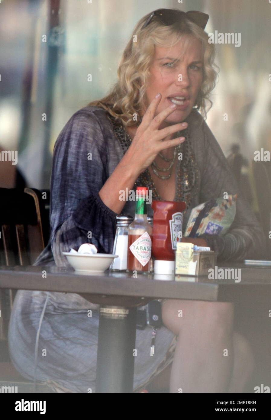 EXCLUSIVE!! Looking like a hippie chick, actress Daryl Hannah leaves ...
