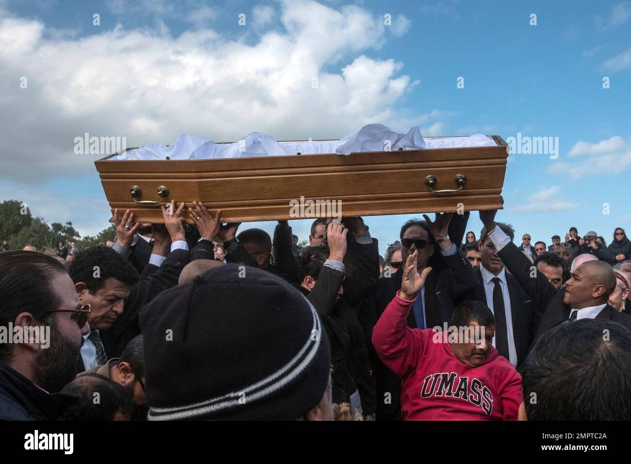 Relatives and friends of Tunisian-born designer Azzedine Alaia carry ...