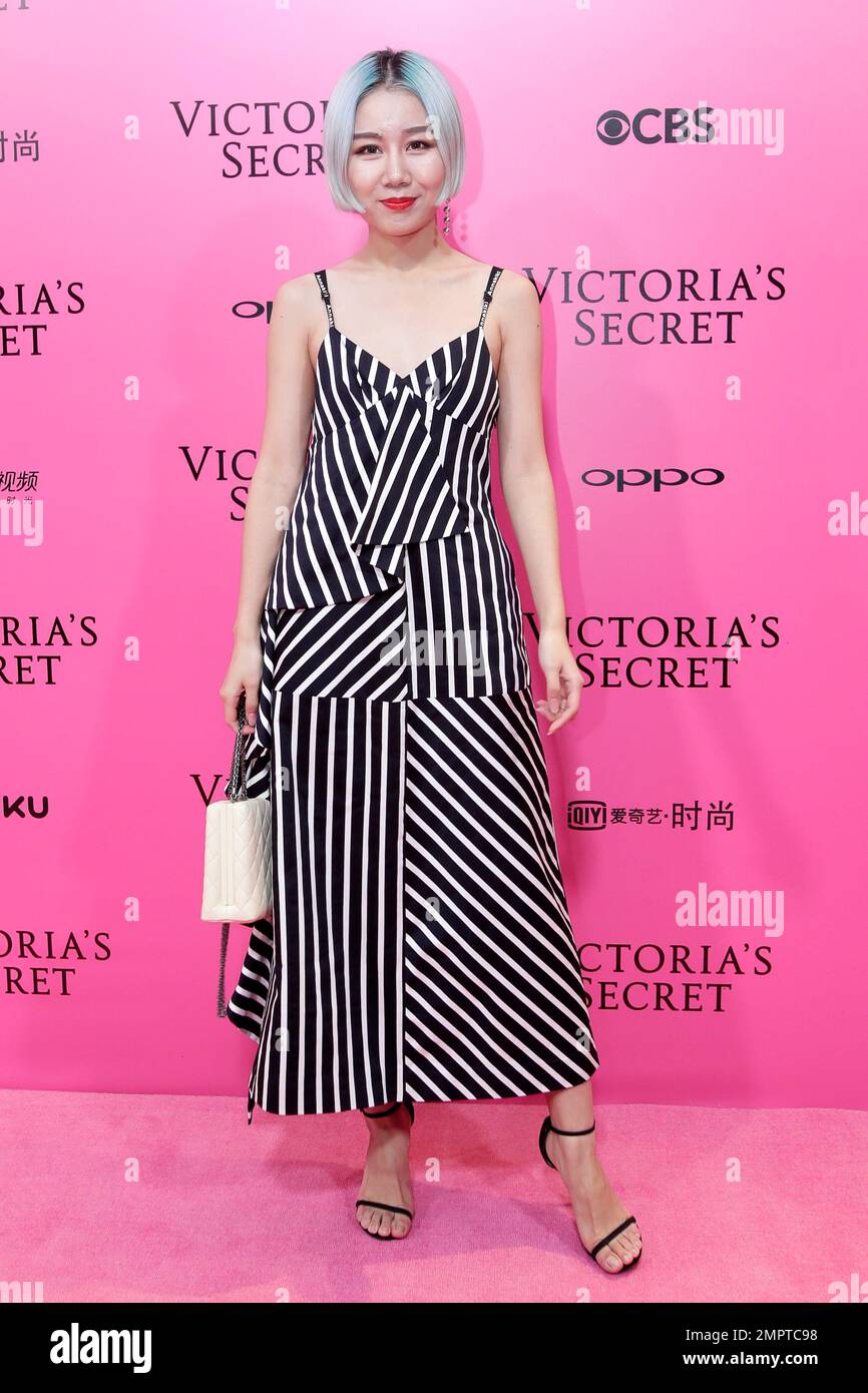 Fashion blogger Yan Xu poses for photos during the pink carpet ahead of ...