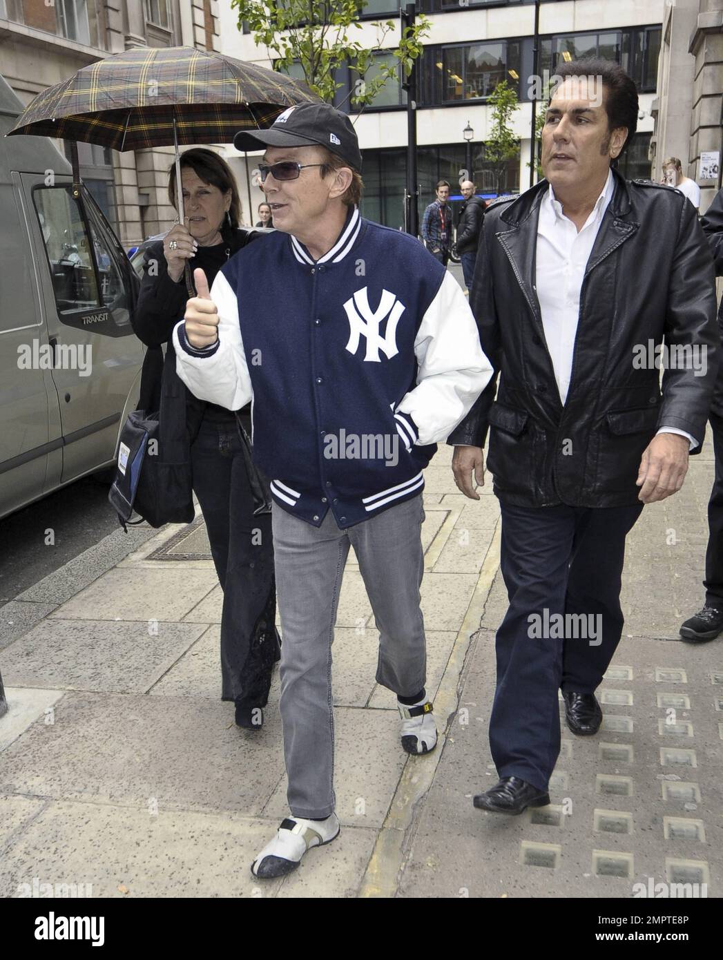 Wearing a New York Yankees jacket, David Cassidy flashes a thumbs up ...