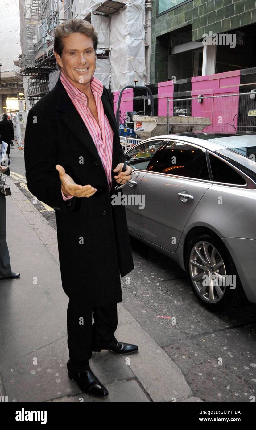 David Hasselhoff poses for photos while walking to his car after ...