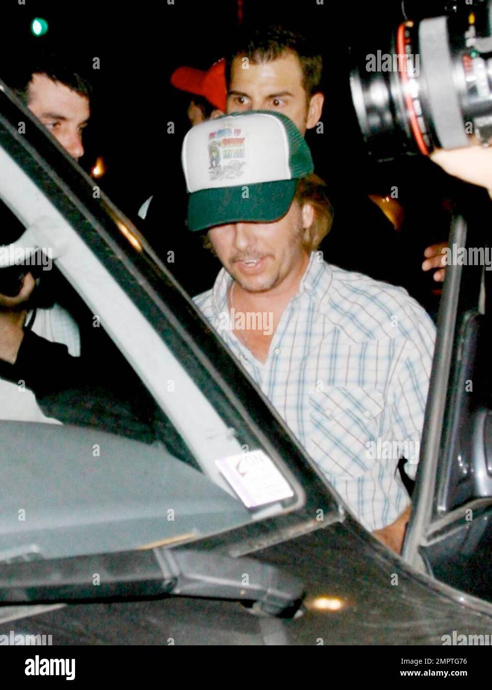 David Spade and a female friend leave Coco DeVille. David is wearing ...