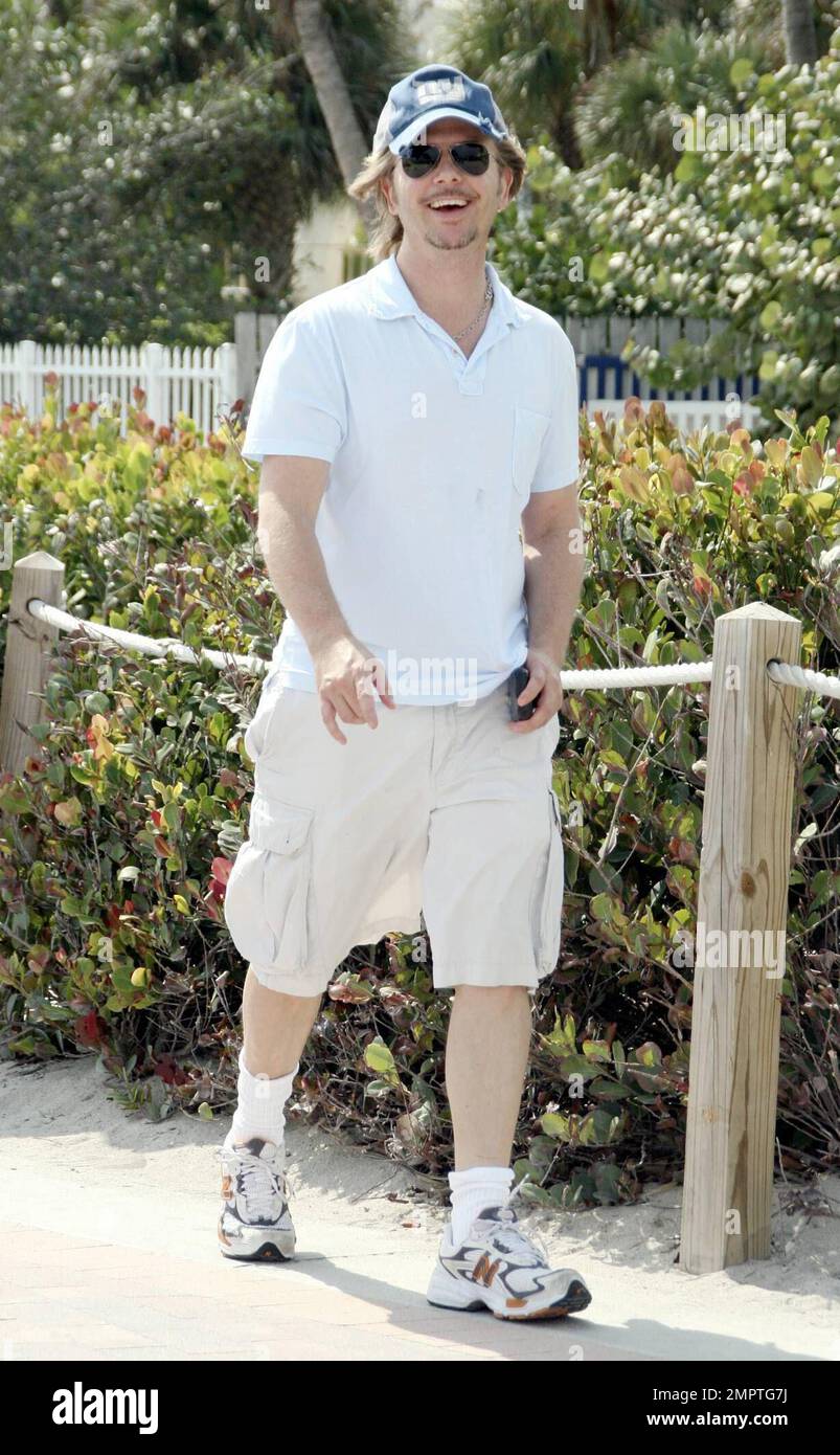 Comedian David Spade plays up to the camera as he enjoys a walk in the ...