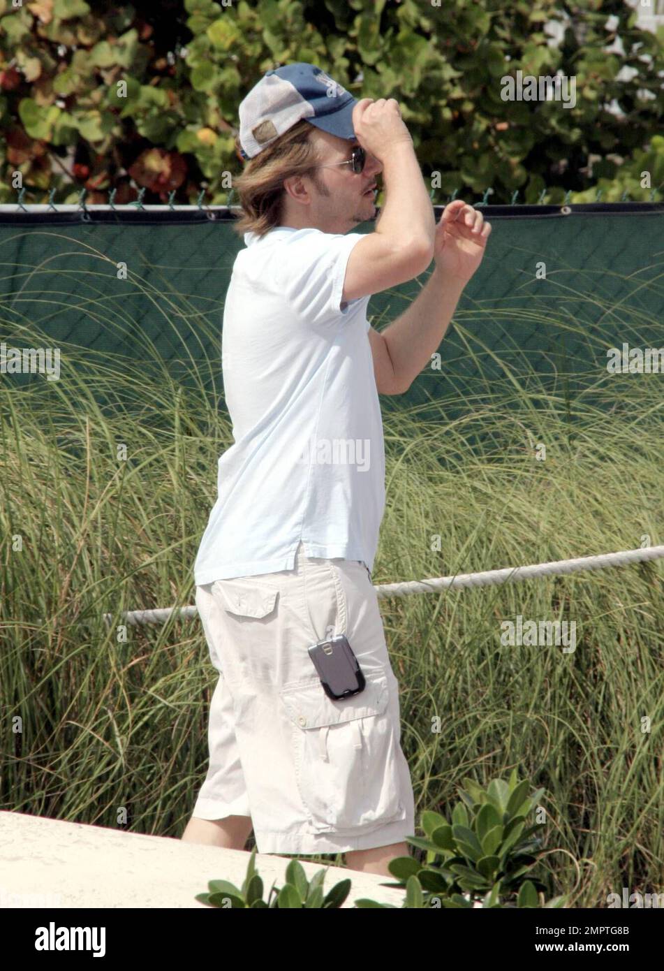 Comedian David Spade plays up to the camera as he enjoys a walk in the ...
